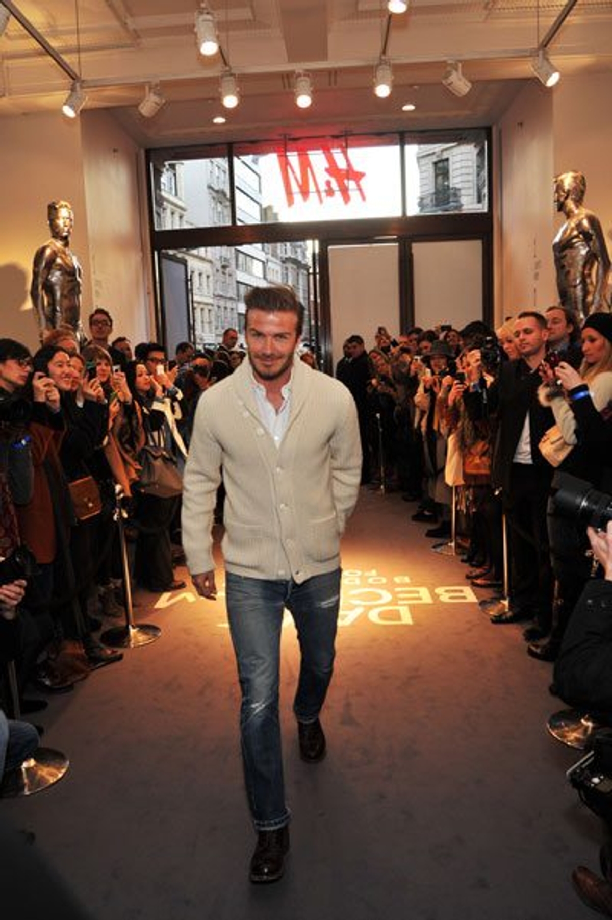 Screaming fans (and Baby Spice!) line up to see David Beckham's hot bod ...