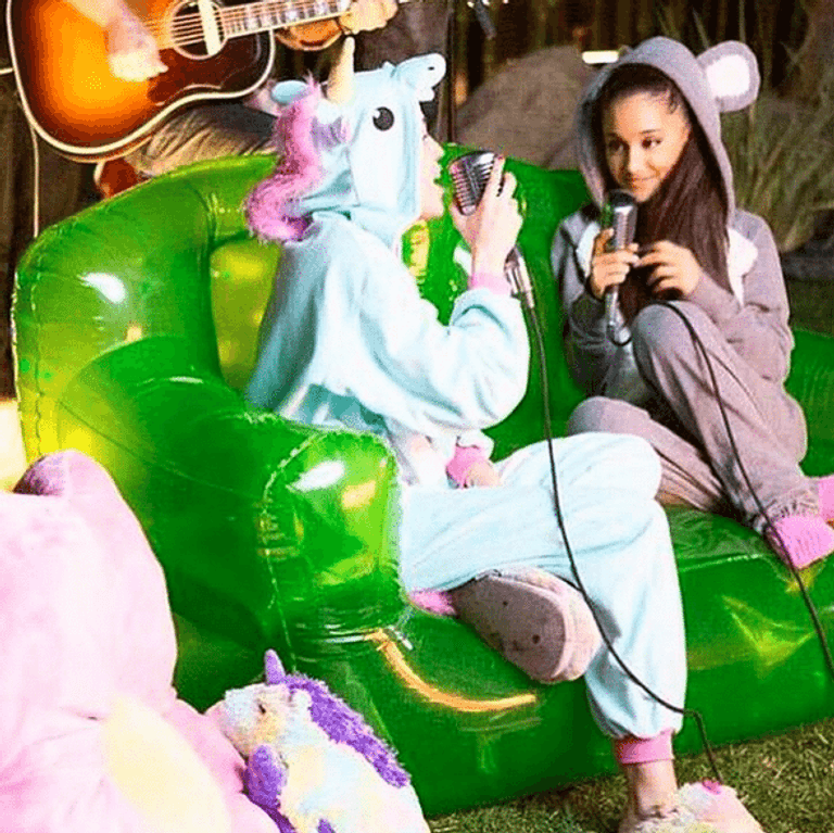 Watch Miley Cyrus and Ariana Grande sing a duet in their onesies for ...